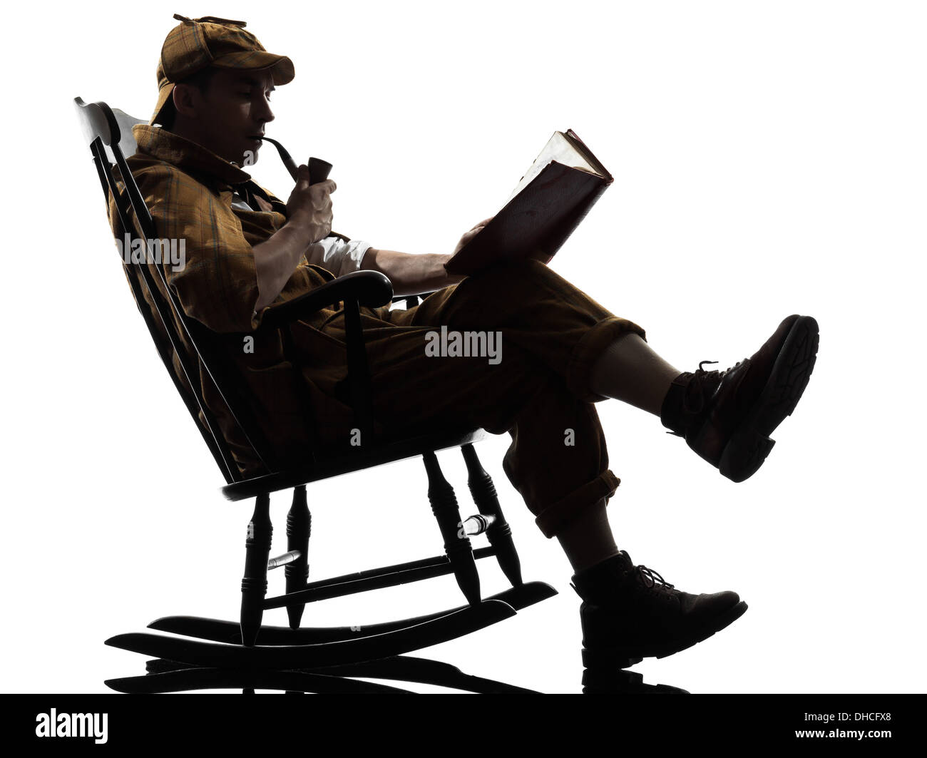 sherlock holmes reading silhouette sitting in rocking chair in studio ...