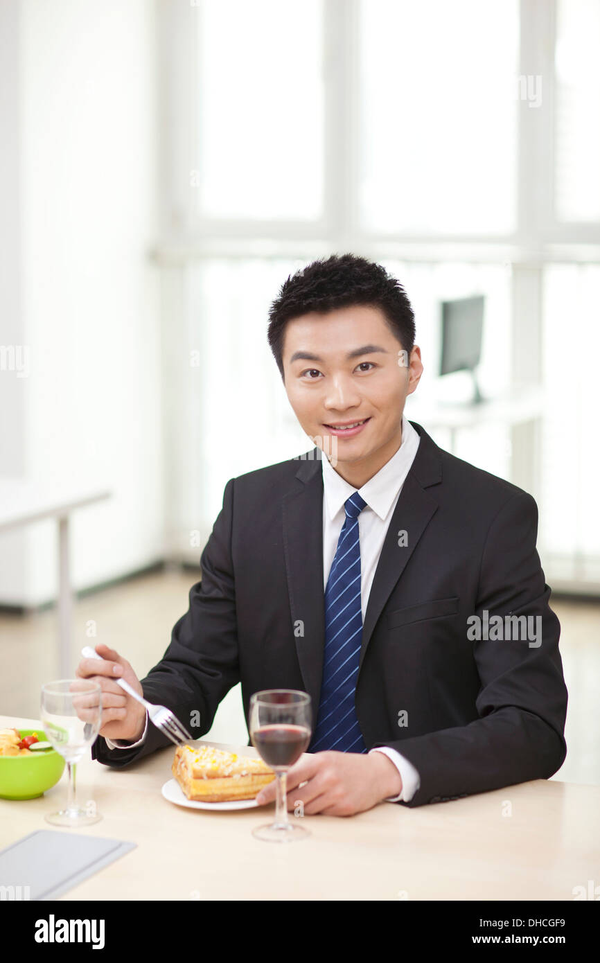 Indian businessman eating desk hi-res stock photography and images - Alamy
