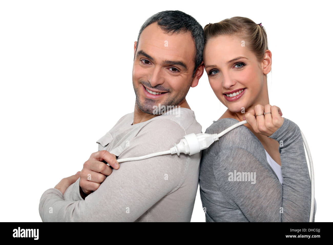 Couple holding electrical cable Stock Photo - Alamy