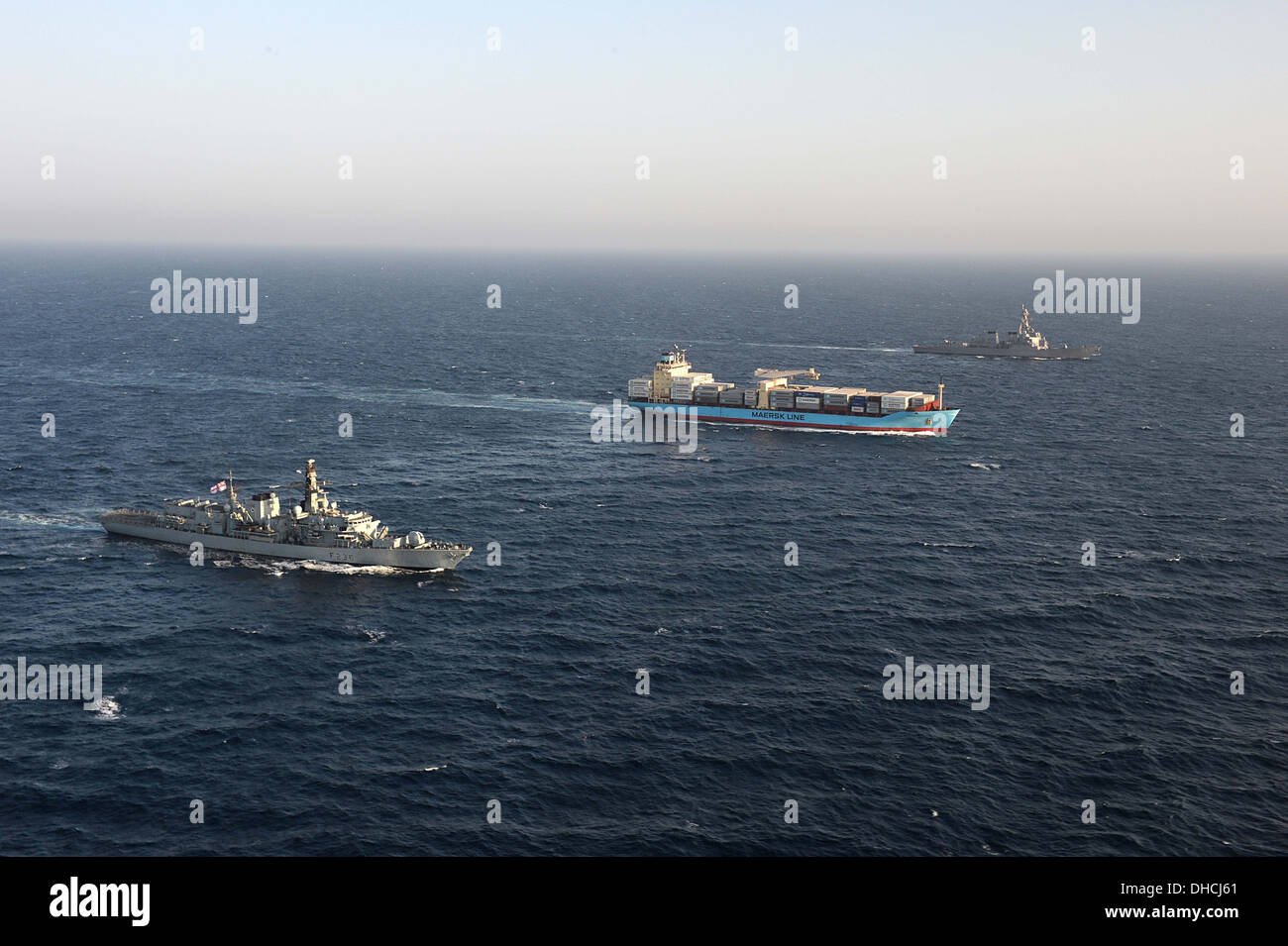 U.S. Navy, British Royal Navy and commercial ships sail in formation ...