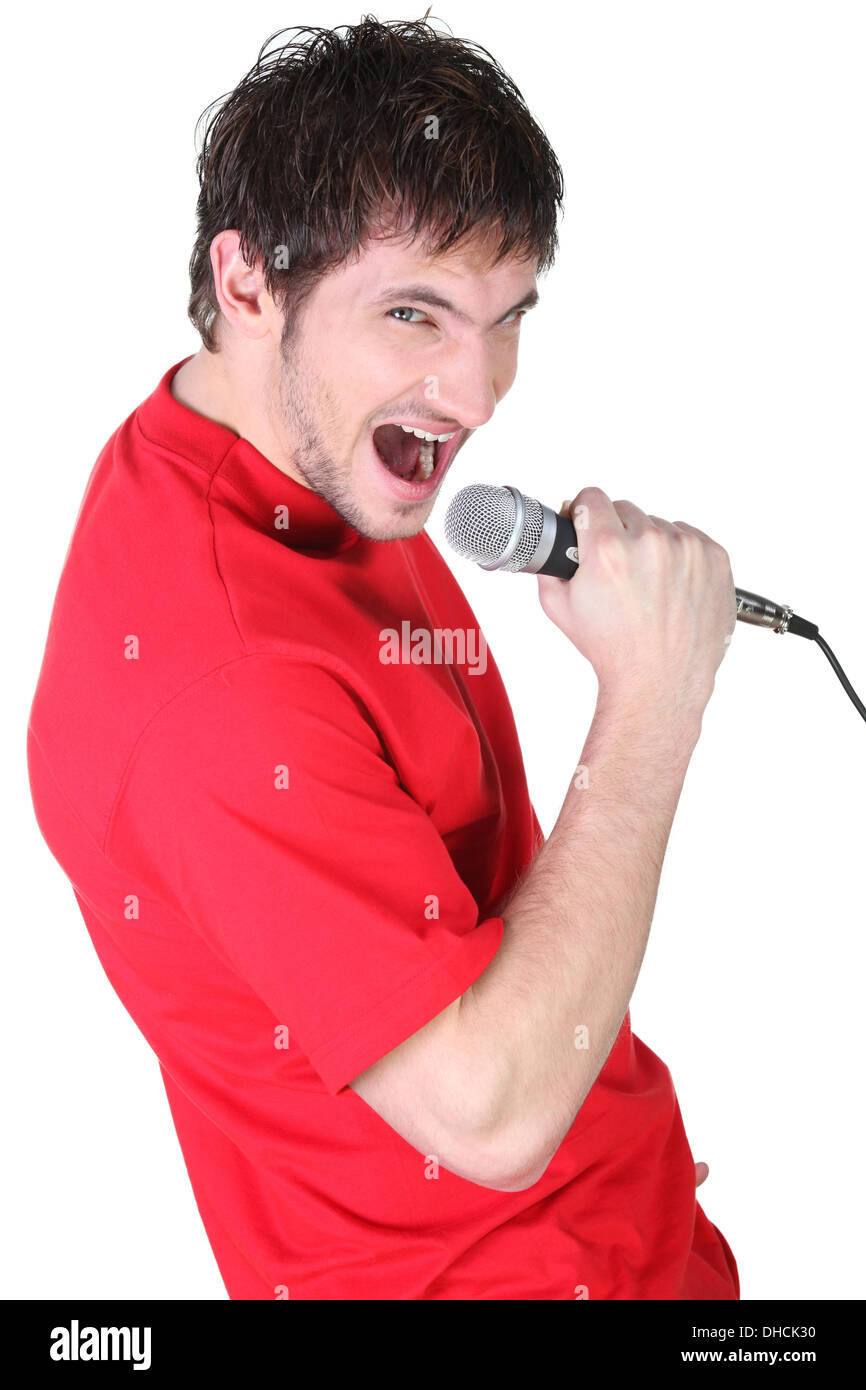 Man singing into the microphone Stock Photo - Alamy