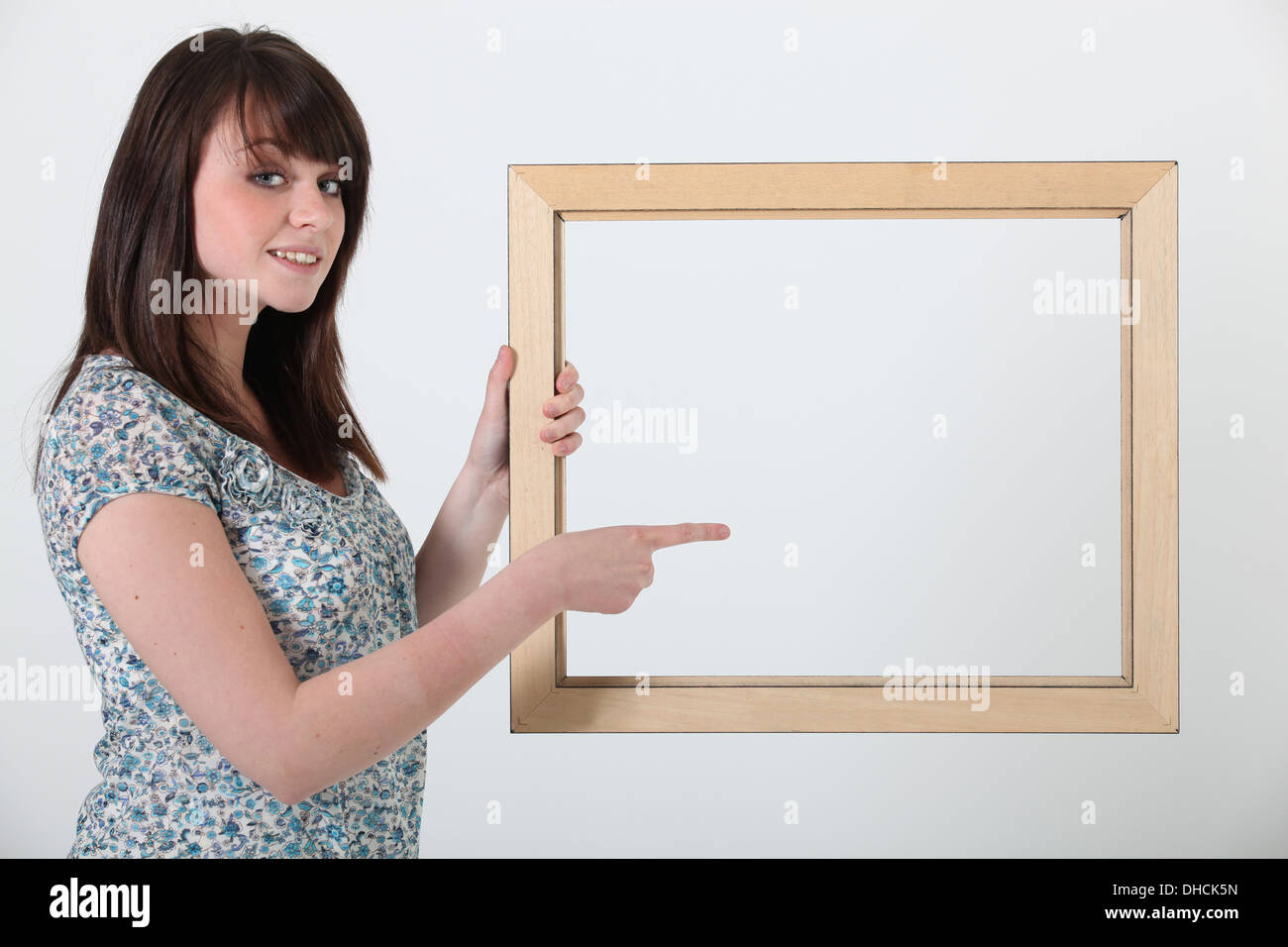Woman with a frame Stock Photo - Alamy