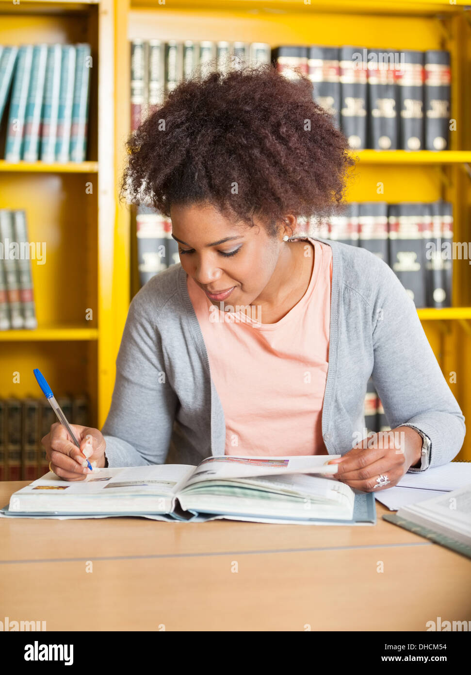 Student writing in book hi-res stock photography and images - Alamy