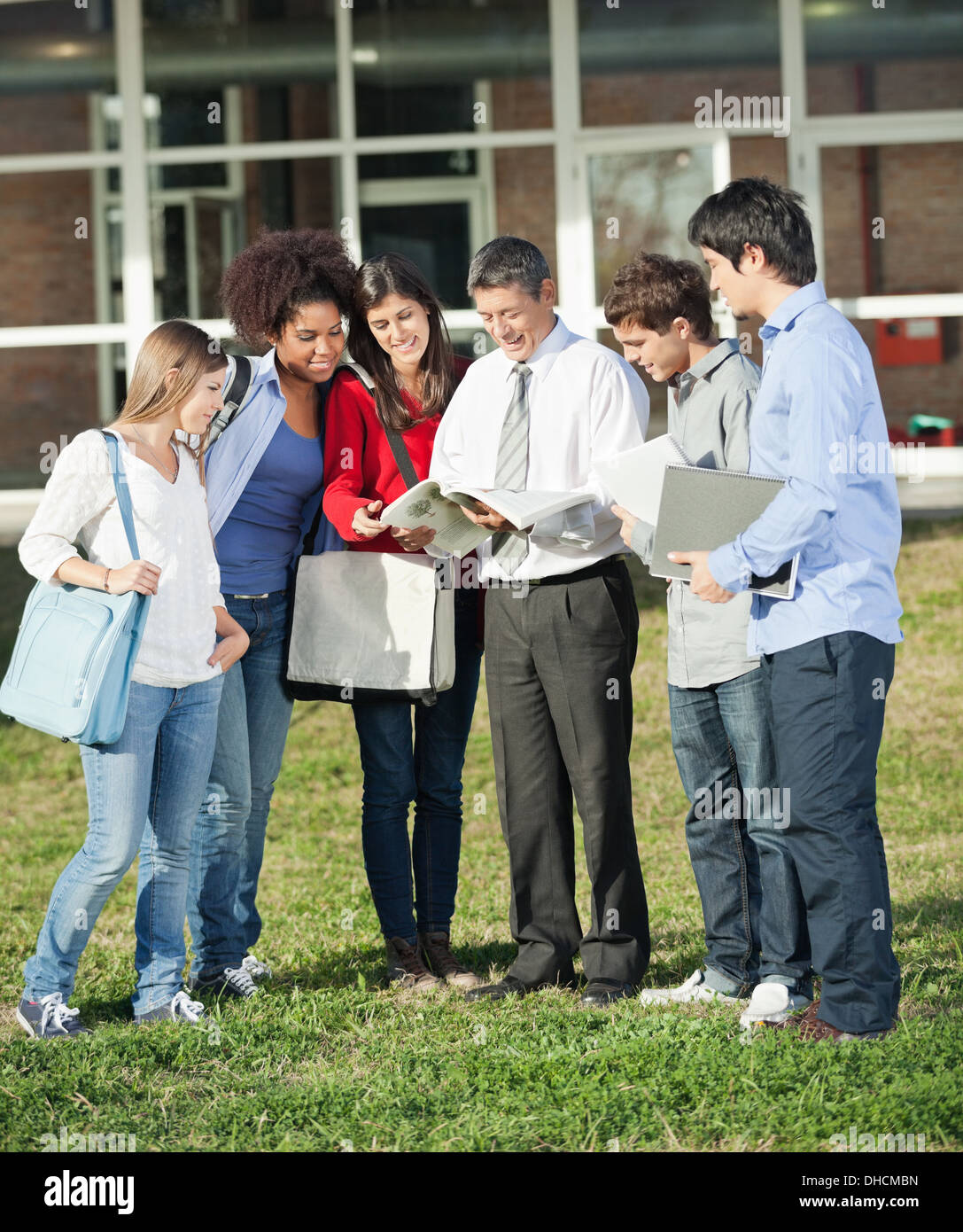 Professor Teaching Lesson To Students On College Campus Stock Photo - Alamy
