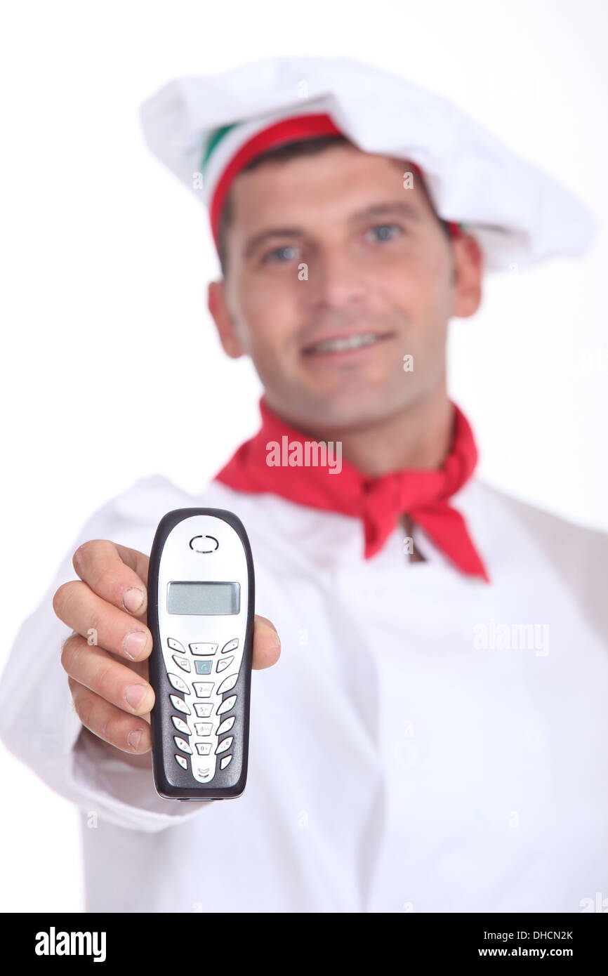 portrait of a pizza chef with phone Stock Photo - Alamy