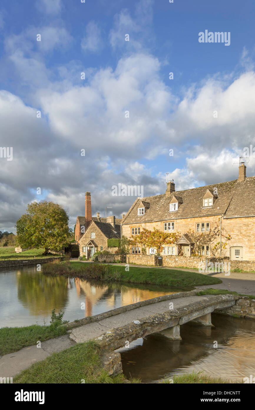 The Cotswold village of Lower Slaughter on the River Eye in evening ...