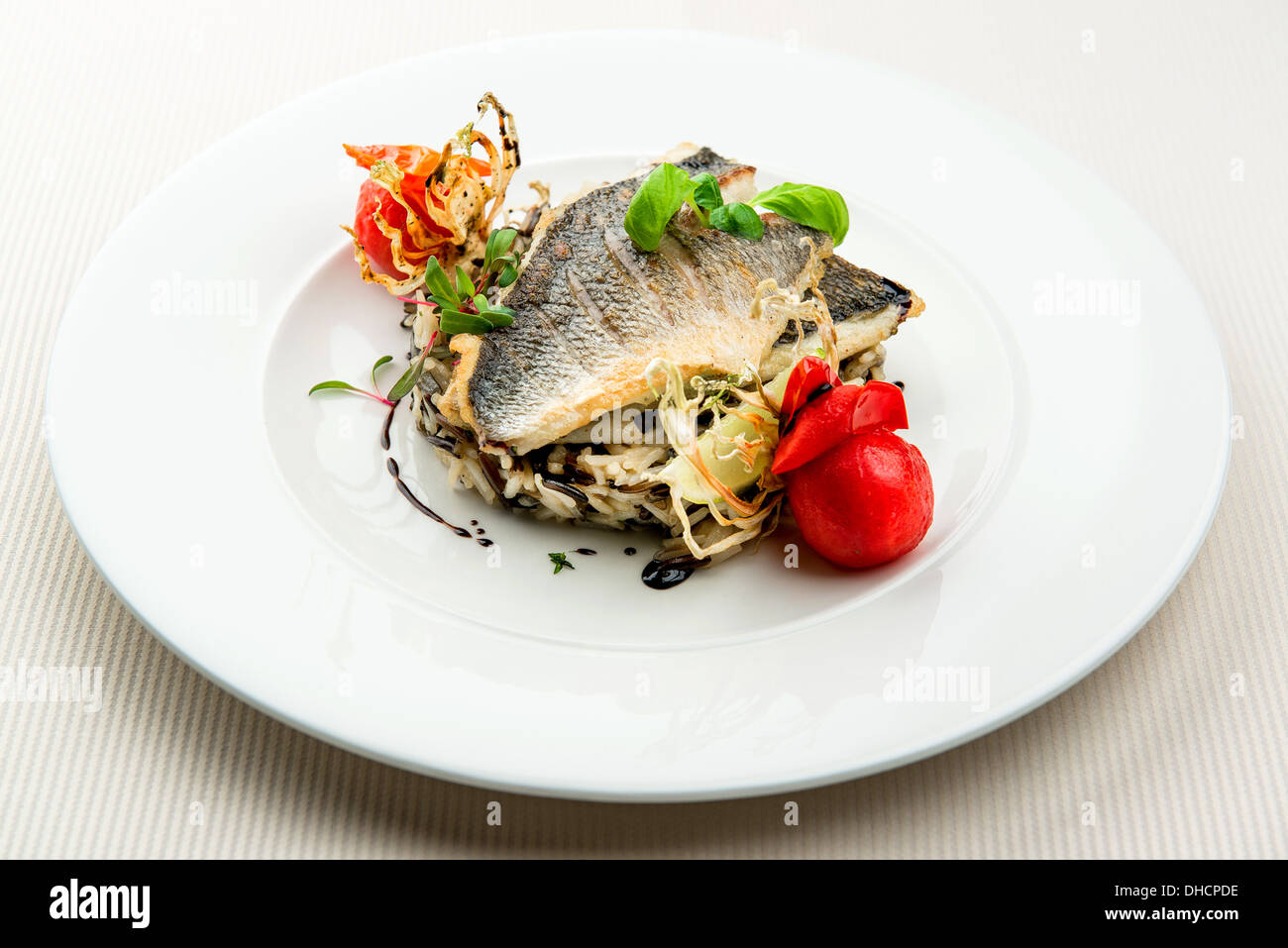 Sea bass with rice Stock Photo - Alamy