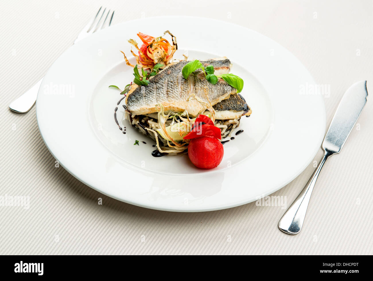 Sea bass with rice Stock Photo - Alamy