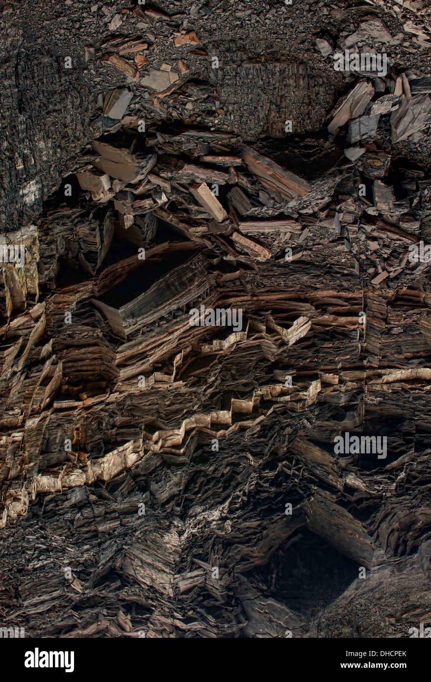 Layers of zig zagging rock on a rock face Stock Photo - Alamy