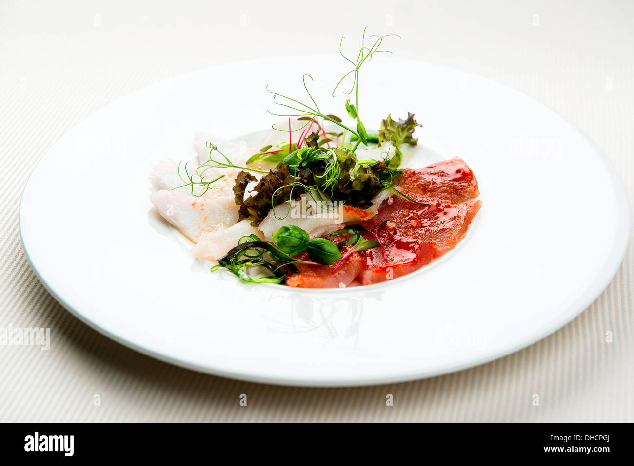 Cold appetizer, slices of trout and herring Stock Photo - Alamy