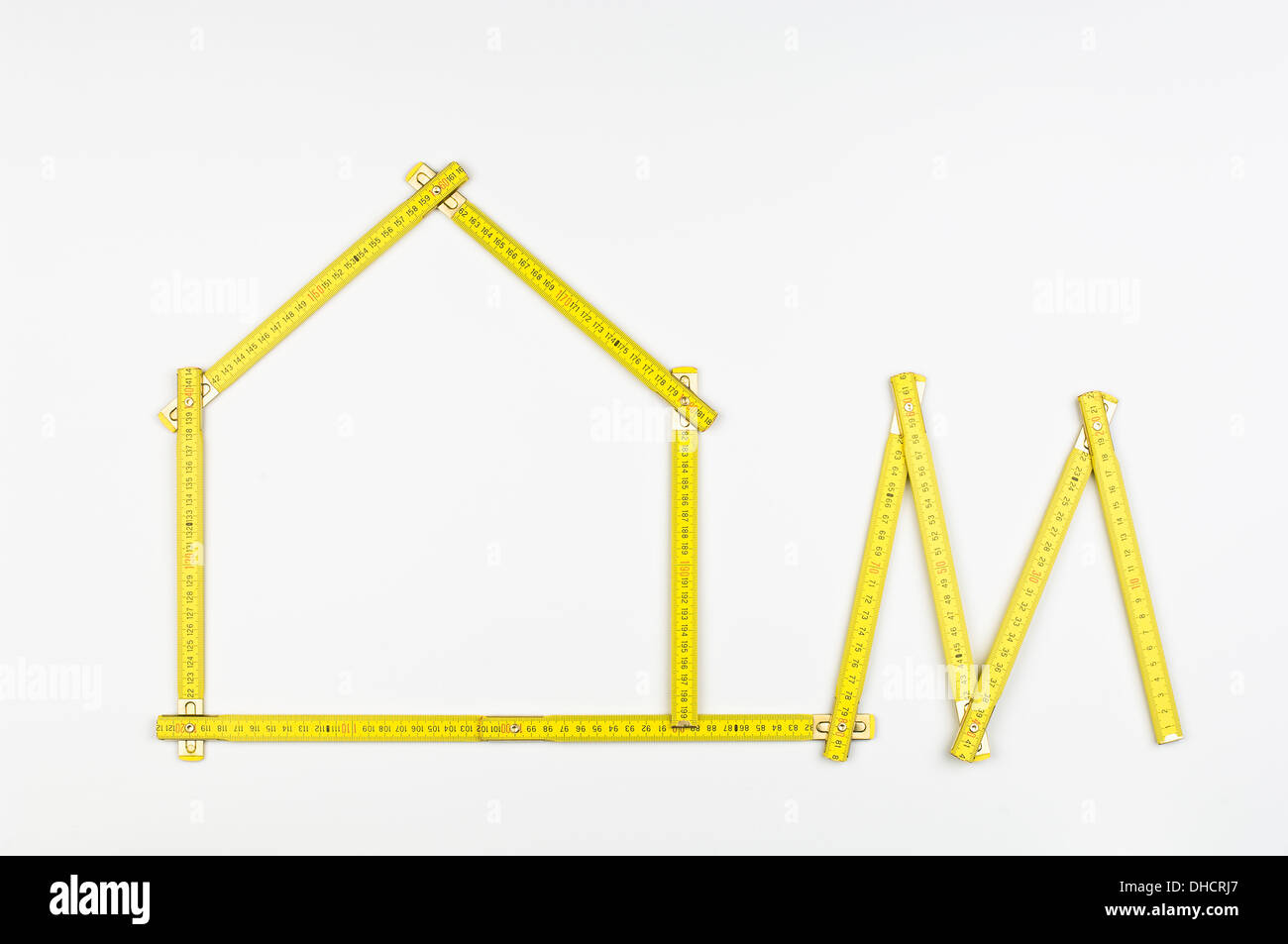 Folded ruler in house shape Stock Photo - Alamy