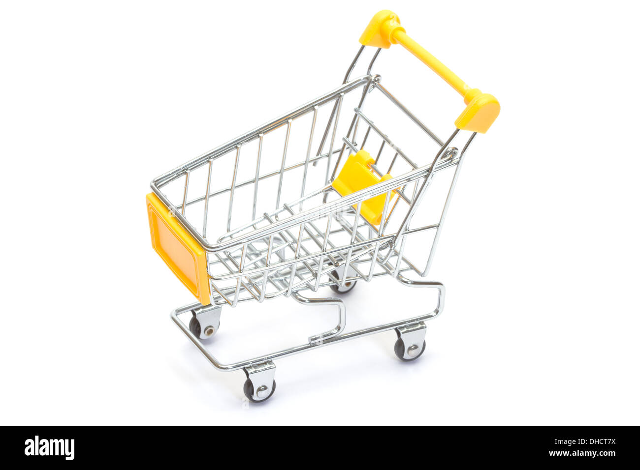 Yellow shopping cart on white Stock Photo - Alamy