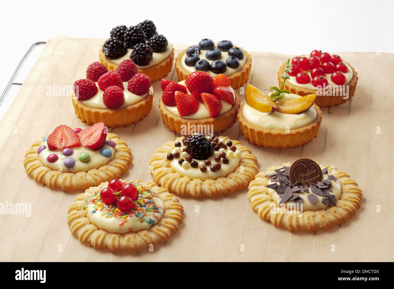 Several pies with different toppings, studio shot Stock Photo - Alamy