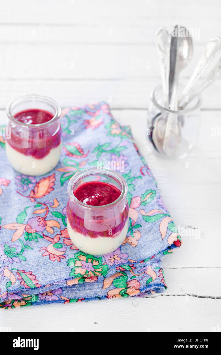 Semolina porridge with raspberry puree in glasses Stock Photo - Alamy