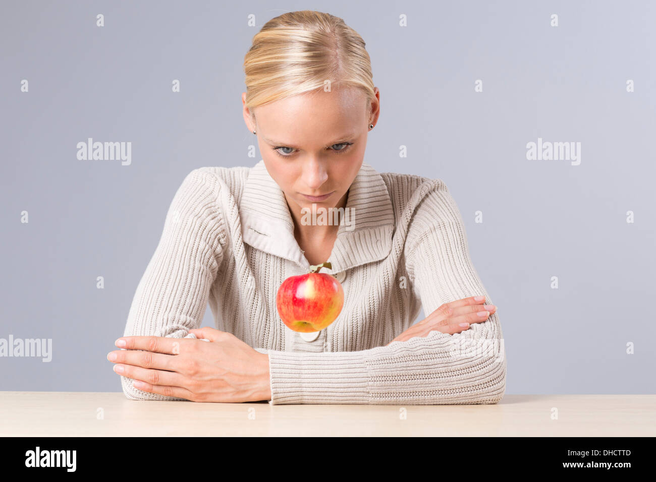Looking at apple Cut Out Stock Images & Pictures - Alamy