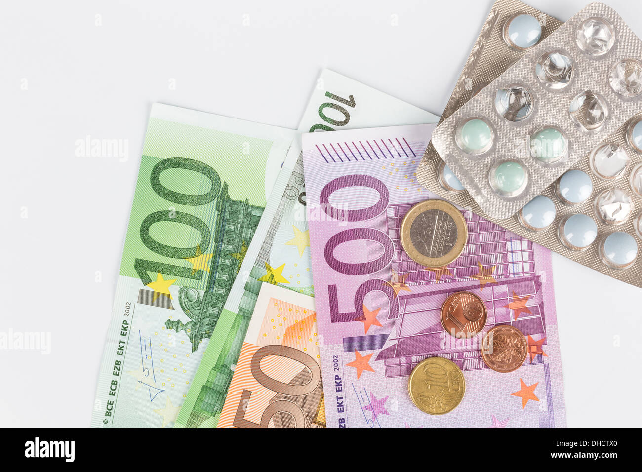 Tablets, Euro notes and coins Stock Photo - Alamy