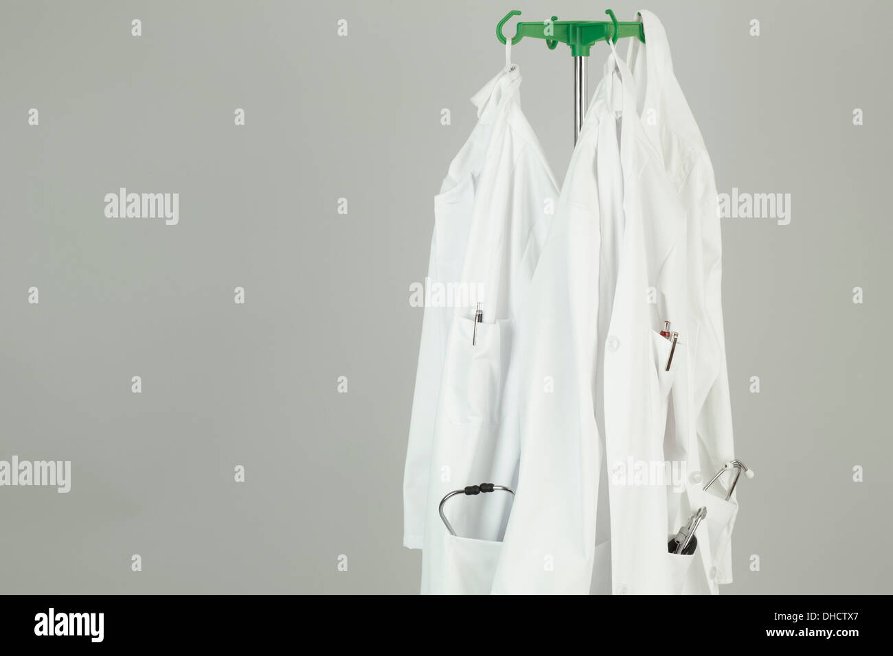 Doctor's overalls on clothes stand with medical instruments Stock Photo ...