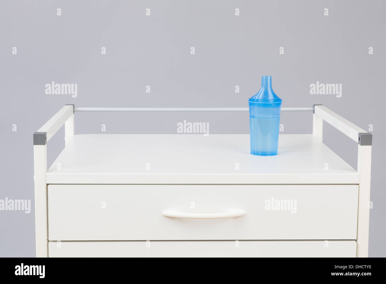 Feeding cup on rolling table Stock Photo - Alamy