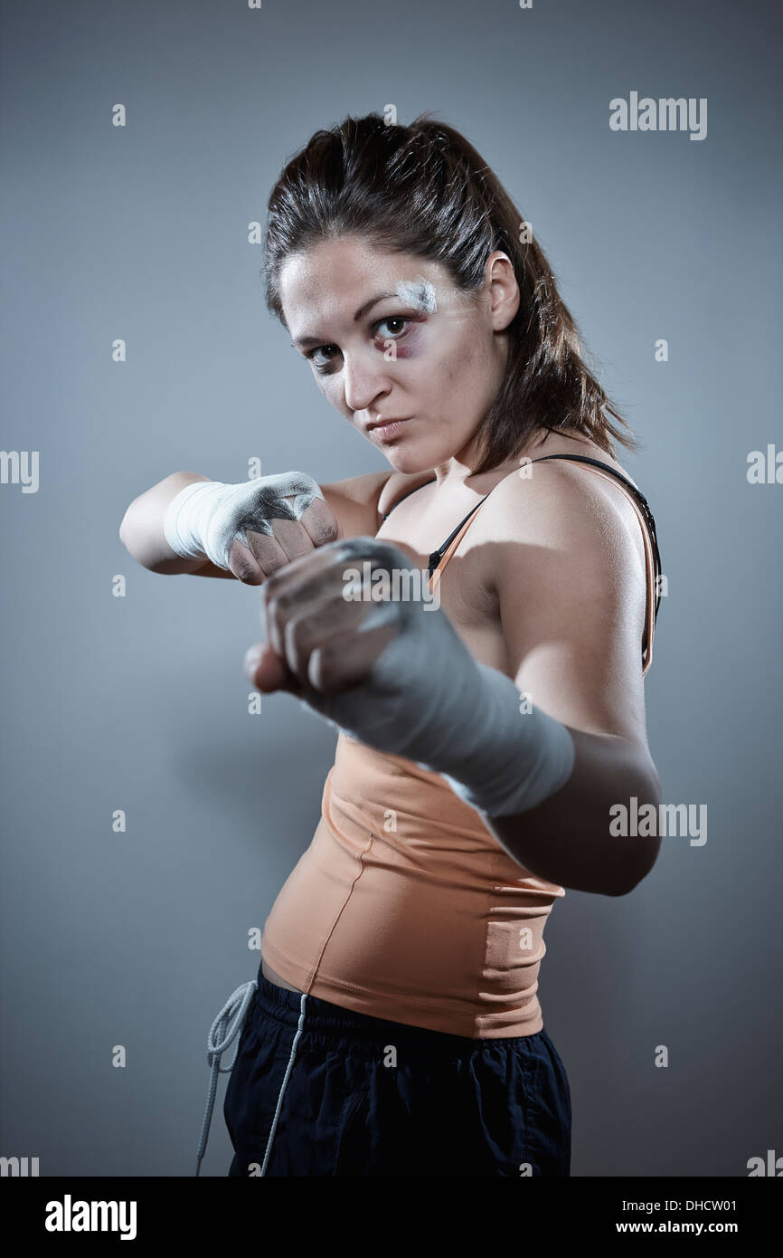 Portrait of a young female boxer in defending position Stock Photo - Alamy
