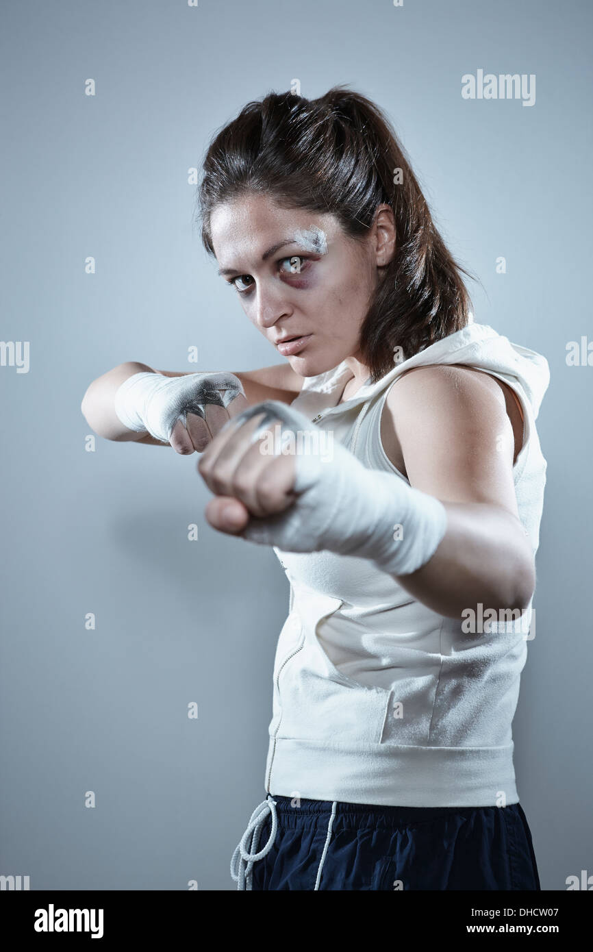 Portrait of a young female boxer in defending position Stock Photo - Alamy