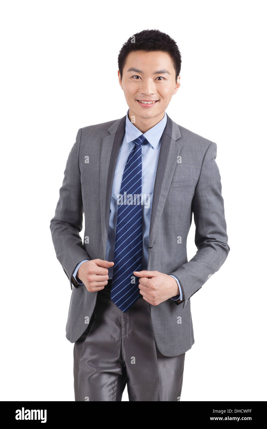 Portrait of young businessman standing in white background Stock Photo ...