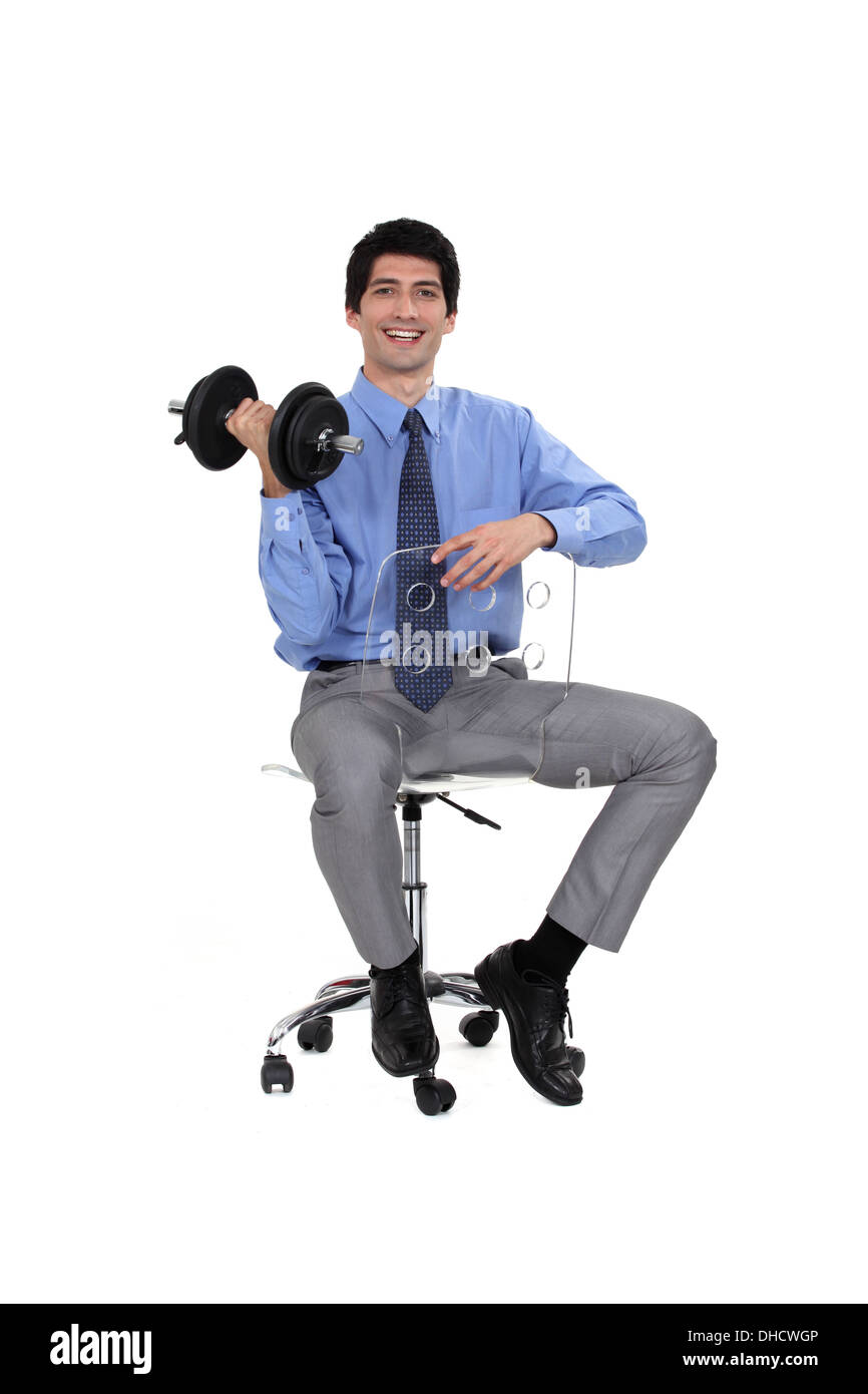 Businessman lifting weights Stock Photo - Alamy