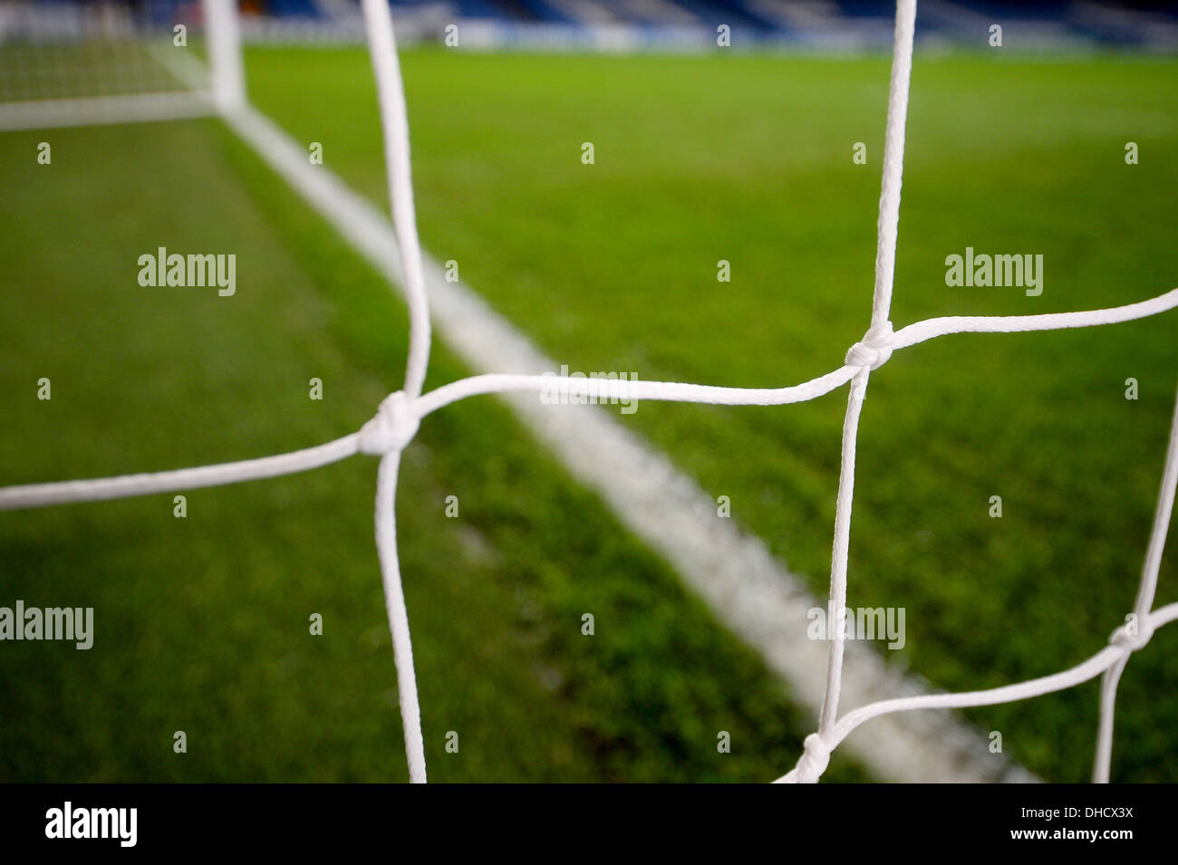 A view of a goalpost and goal net on a football pitch Stock Photo - Alamy