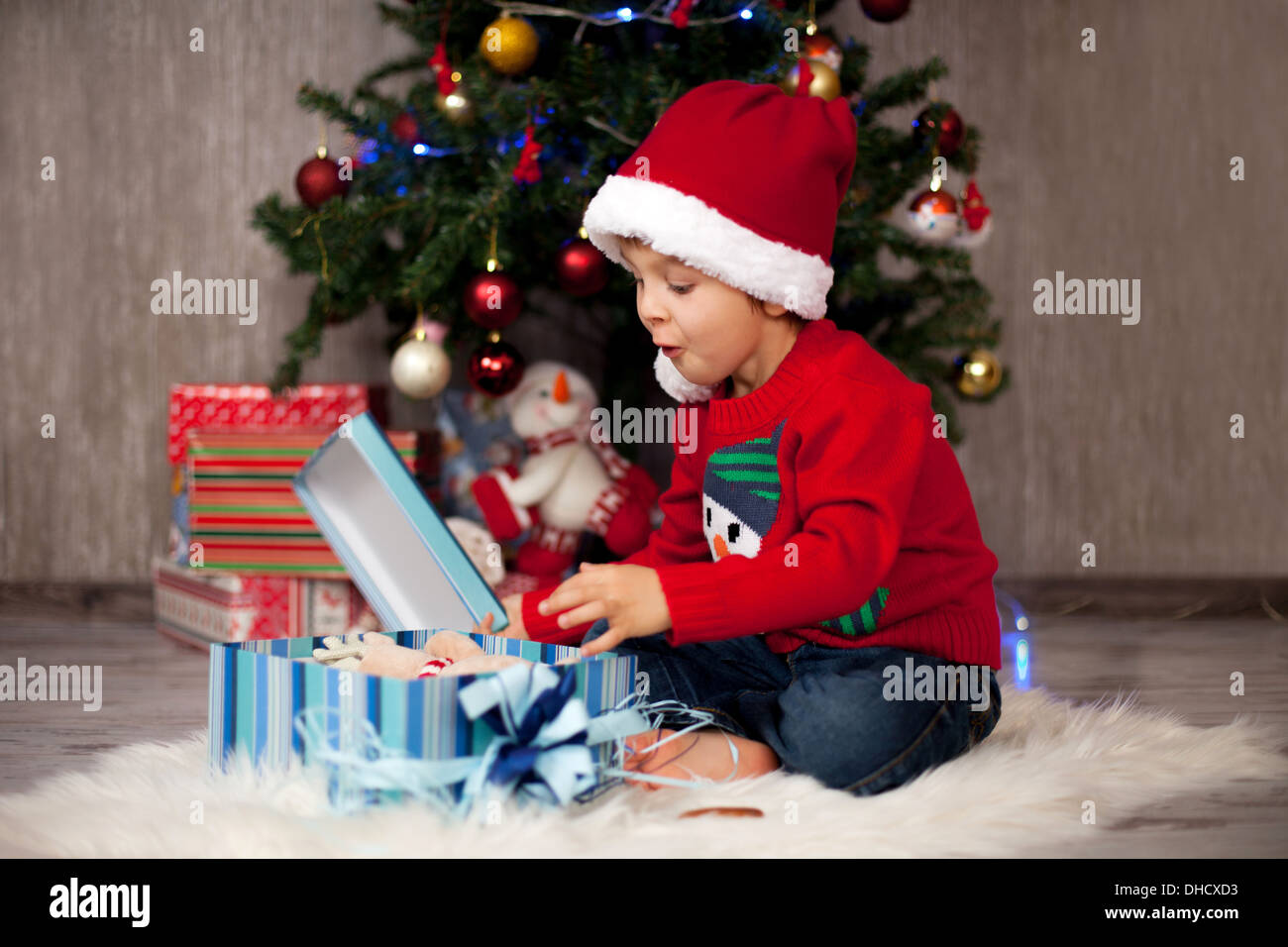 Boy opening presents hi-res stock photography and images - Alamy