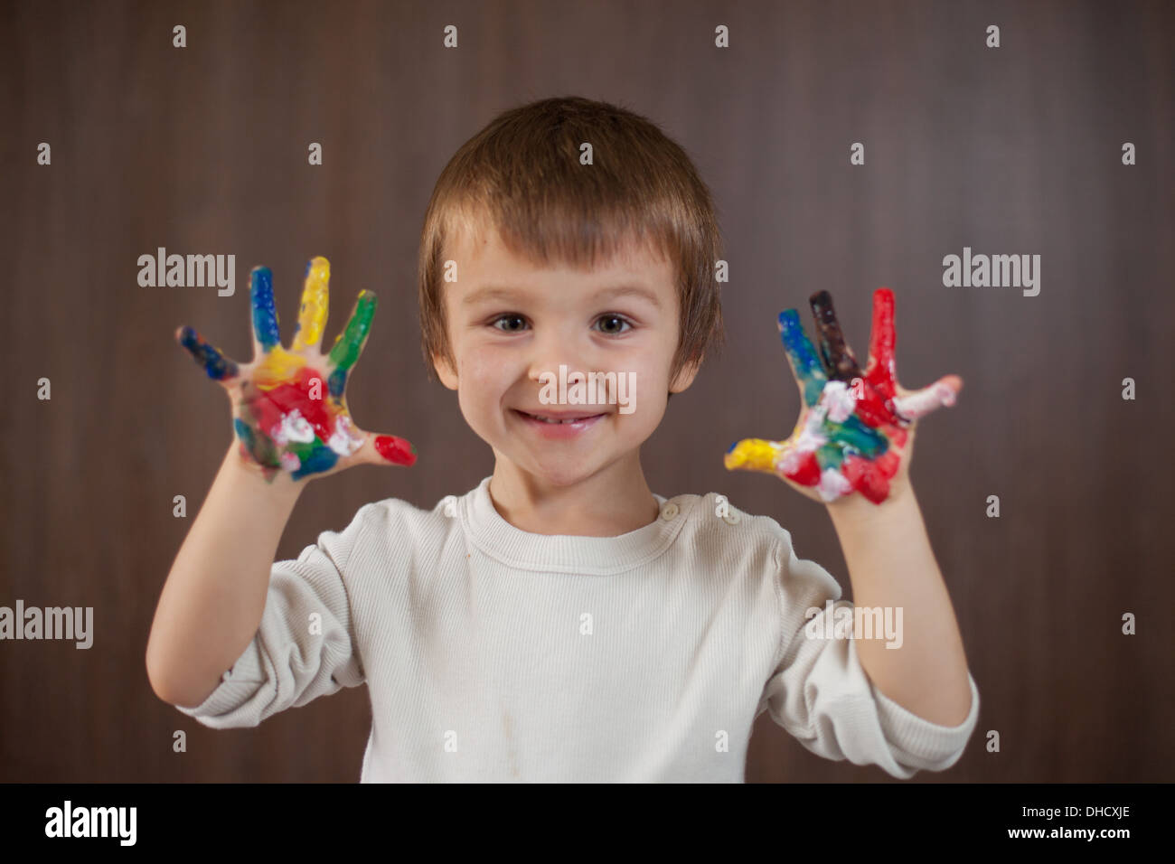 Cute boy with painted hands Stock Photo - Alamy