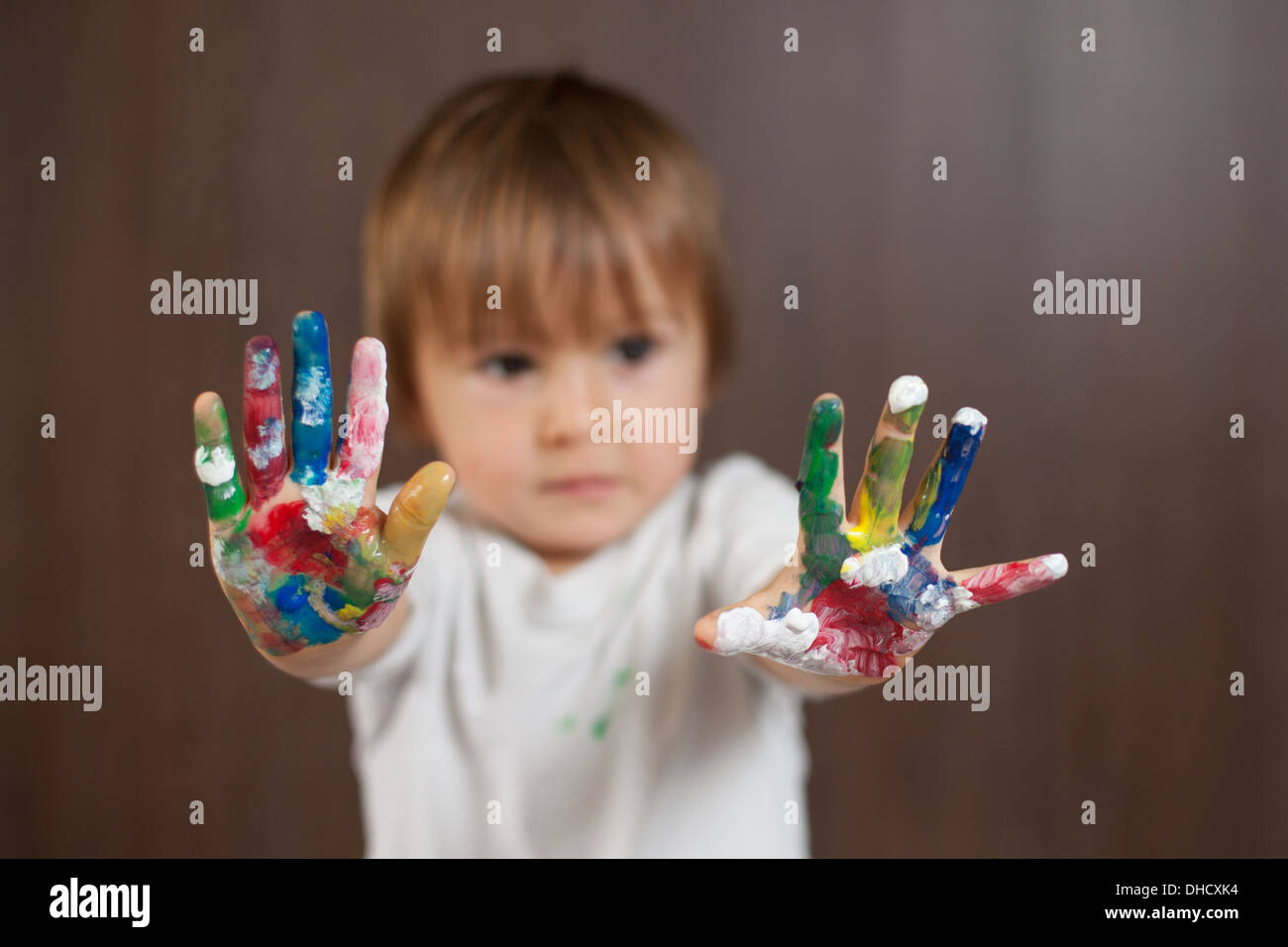Cute boy with painted hands Stock Photo - Alamy