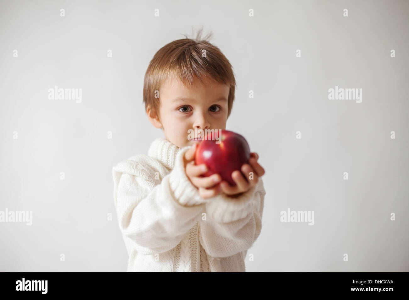 Boy, holding red apple Stock Photo - Alamy