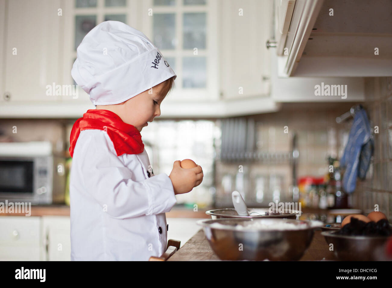 Boy in the kitchen, baking Stock Photo - Alamy