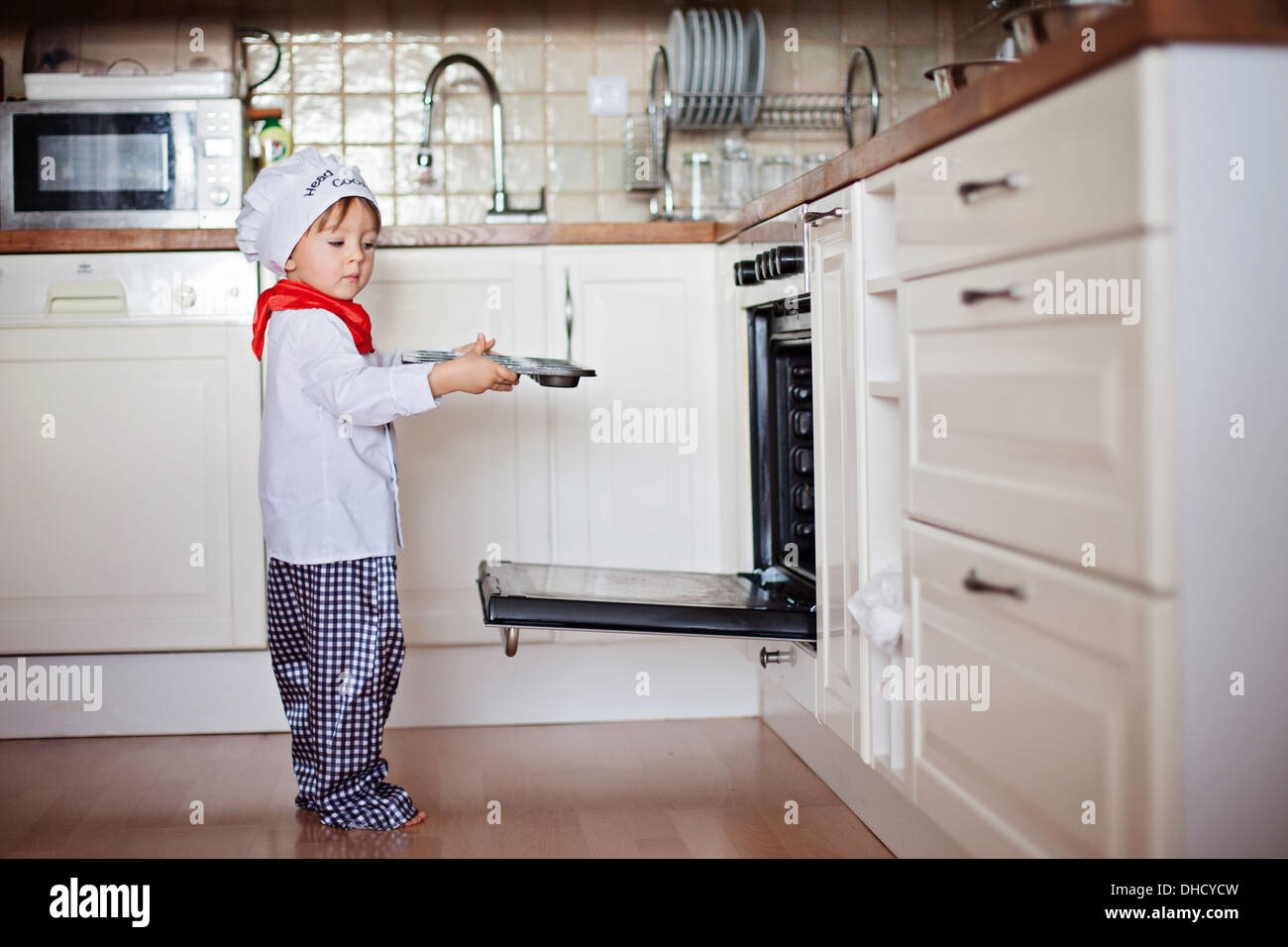 Boy in the kitchen, baking Stock Photo - Alamy