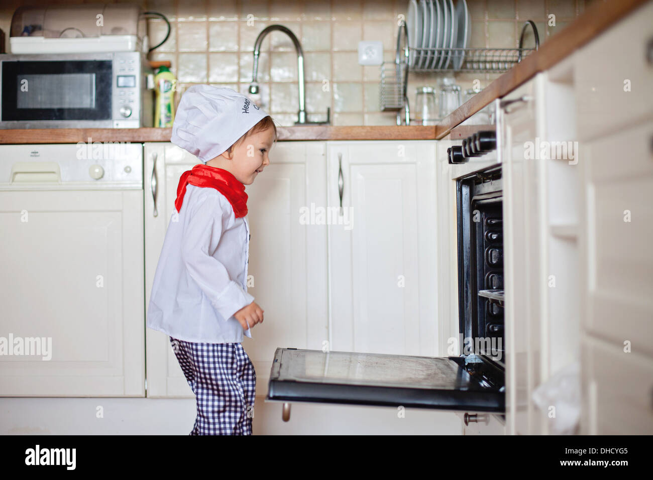 Boy in the kitchen, baking Stock Photo - Alamy