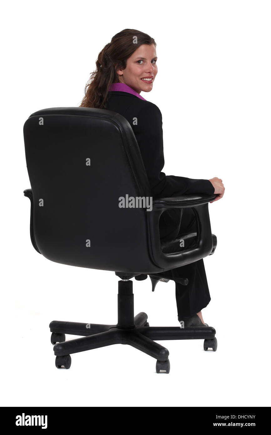 Professional sitting in a chair Stock Photo - Alamy