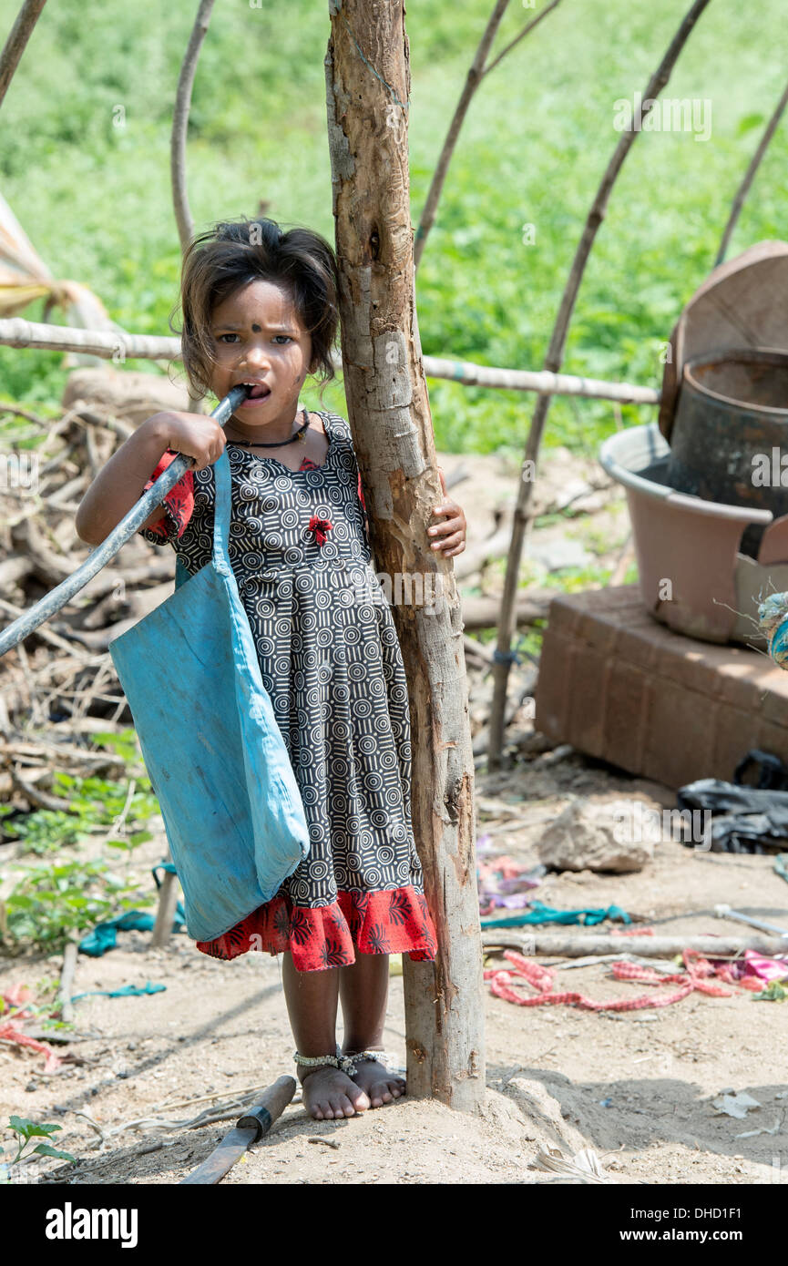 Poor indian lower caste girl outside her bender / tent / shelter ...