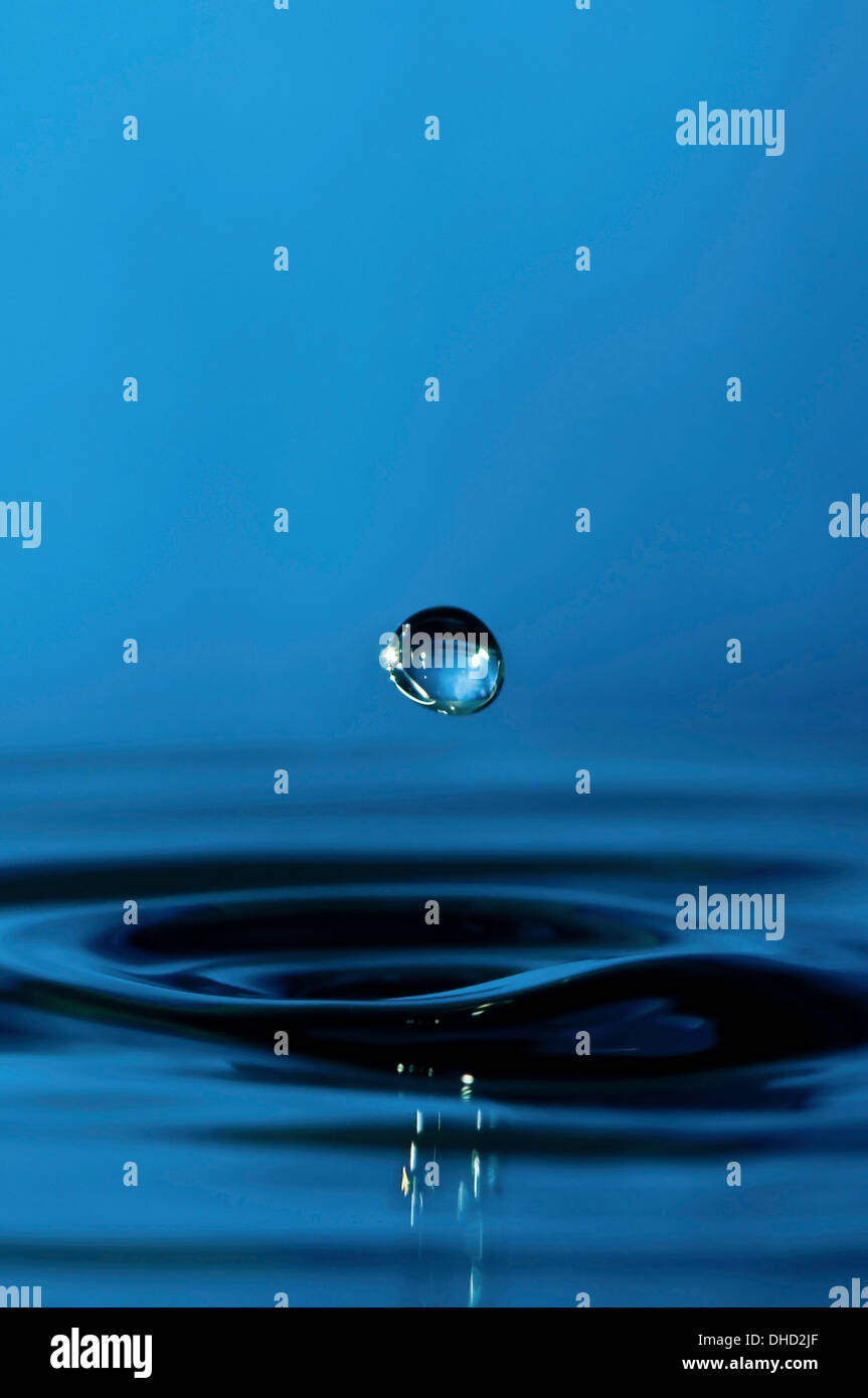 Water drop, blue background Stock Photo - Alamy