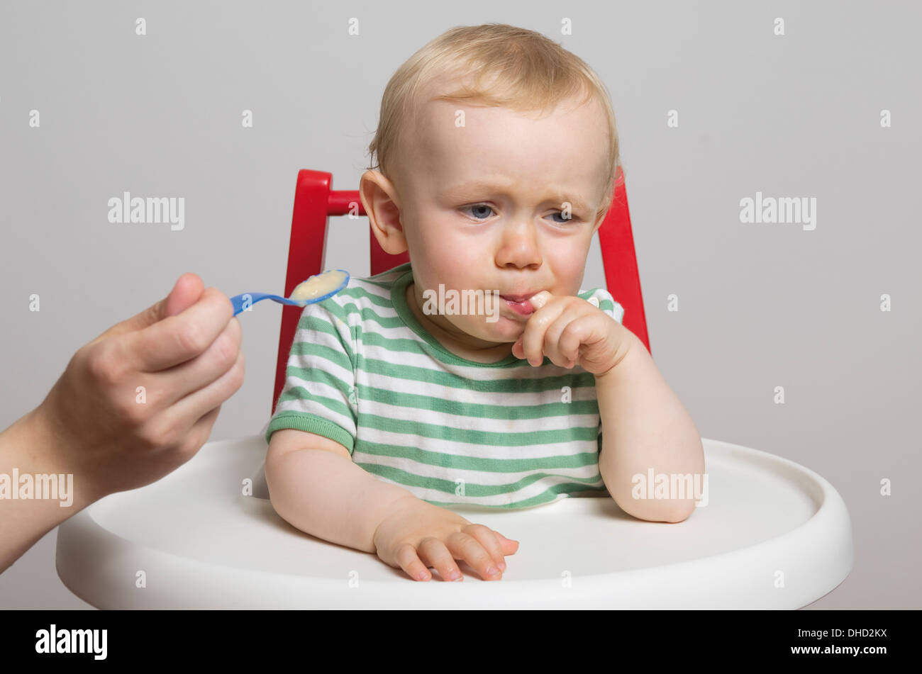 Baby boy refusing food, studio shot Stock Photo - Alamy