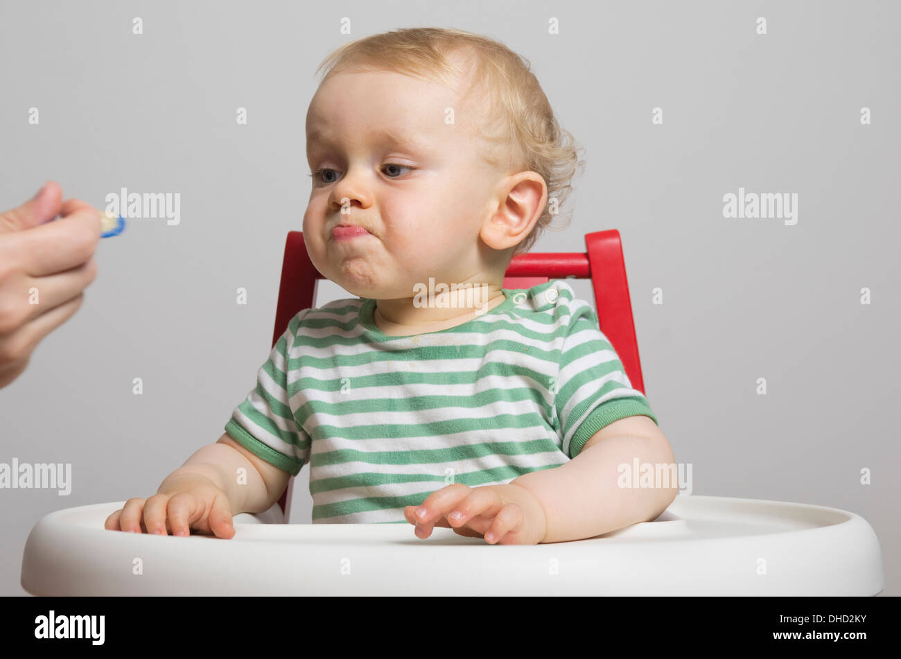 Baby boy refusing food, studio shot Stock Photo - Alamy