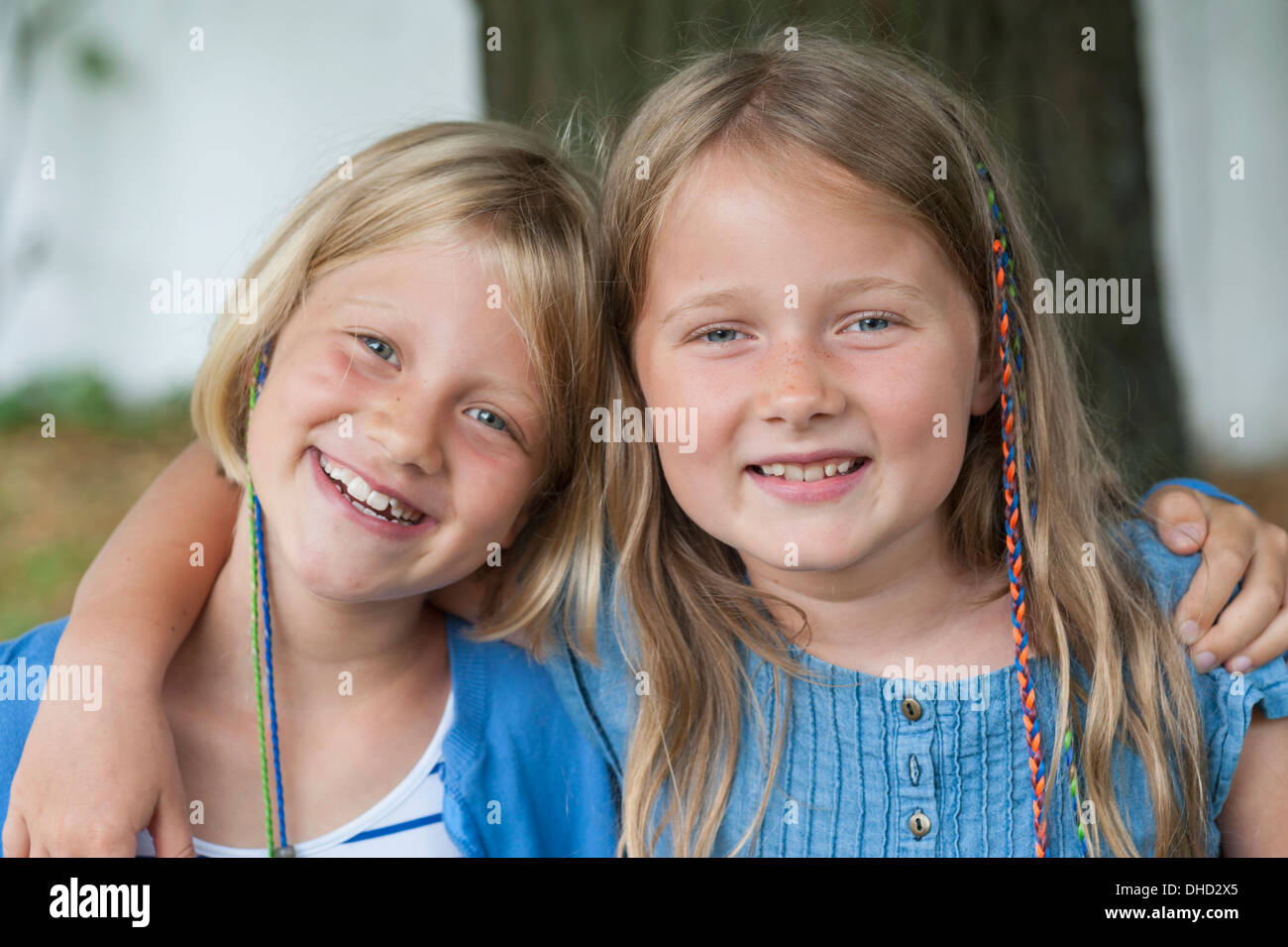 Two happy girls embracing, portrait Stock Photo - Alamy
