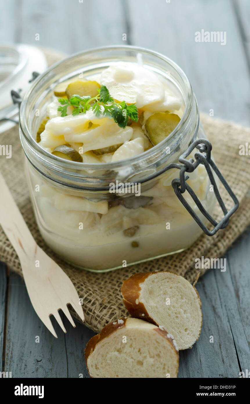 Potato salad in preserving jar with sliced pretzel sticks Stock Photo ...