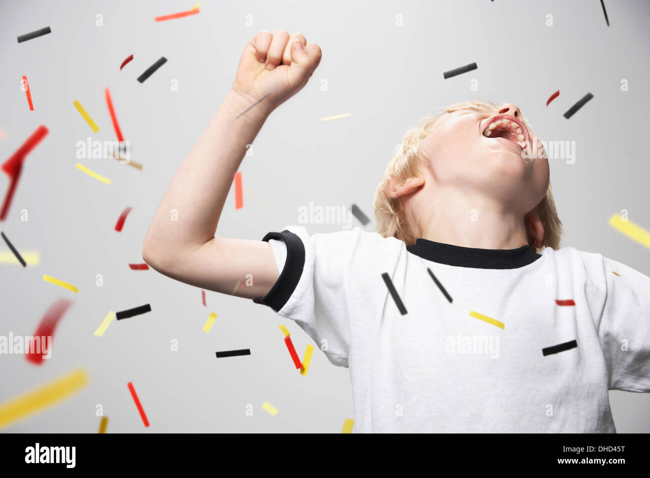 Boy in soccer jersey cheering Stock Photo - Alamy