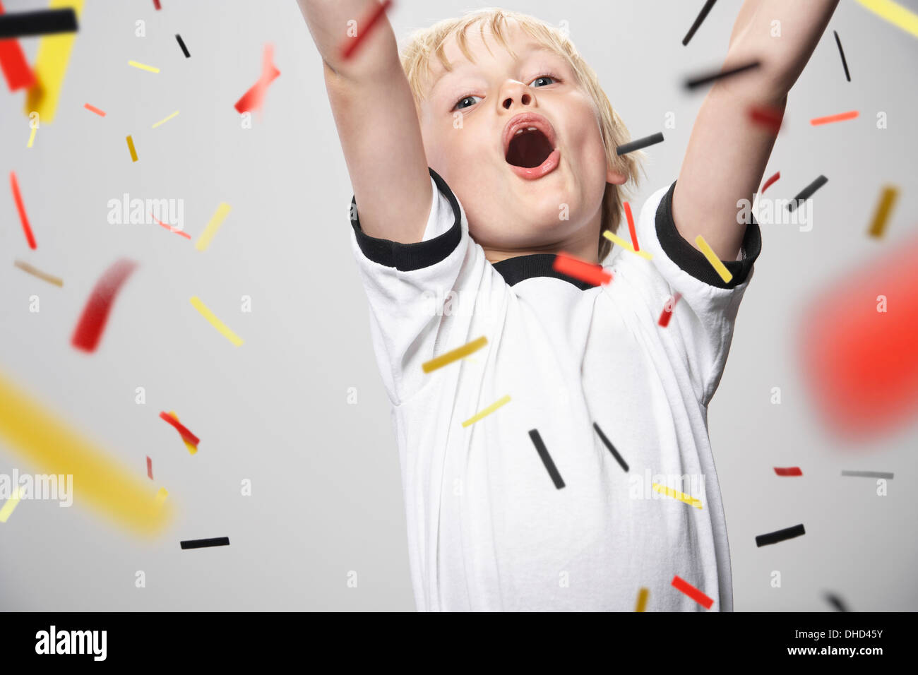 Boy in soccer jersey cheering Stock Photo - Alamy