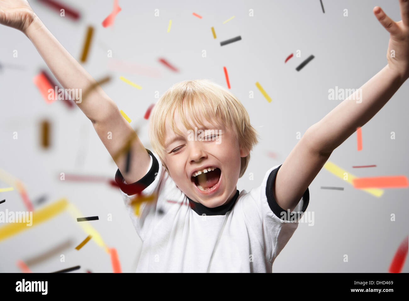 Boy in soccer jersey cheering Stock Photo - Alamy