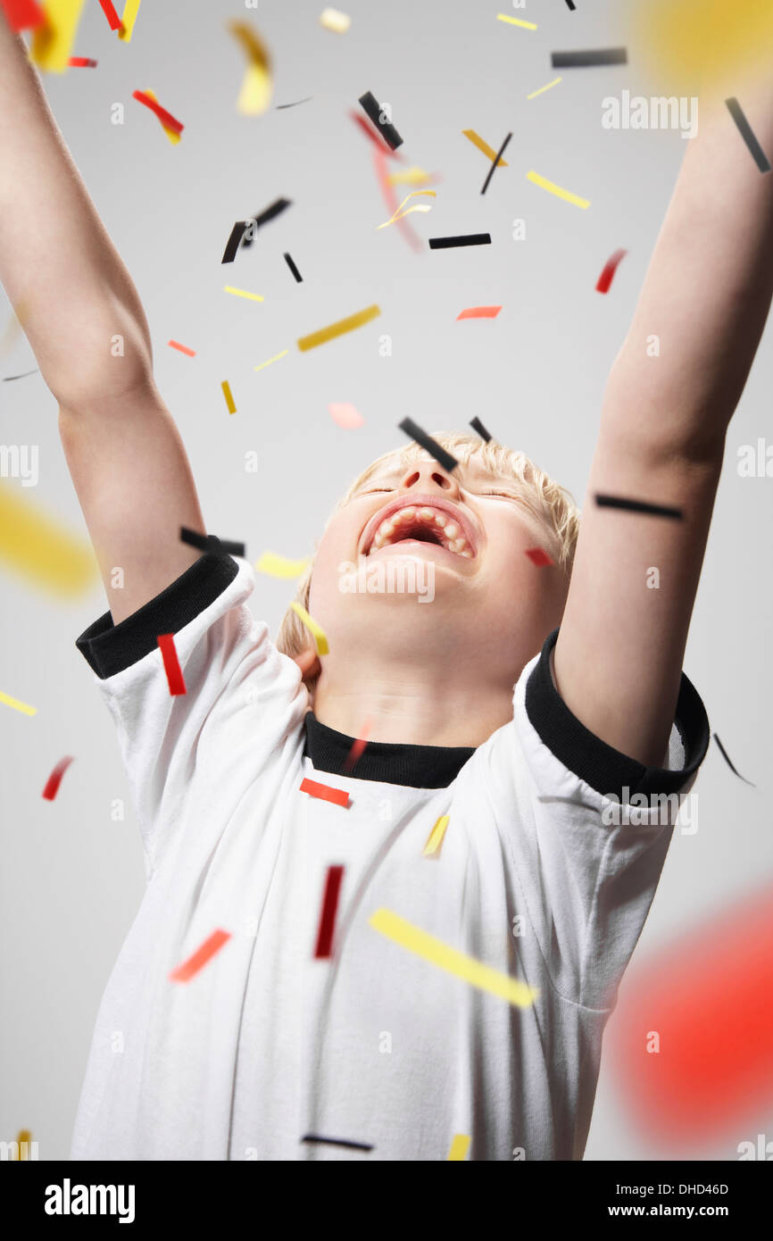 Boy in soccer jersey cheering Stock Photo - Alamy