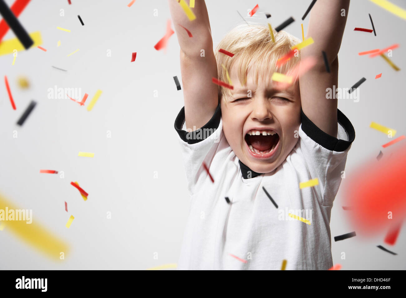 Boy in soccer jersey cheering Stock Photo - Alamy