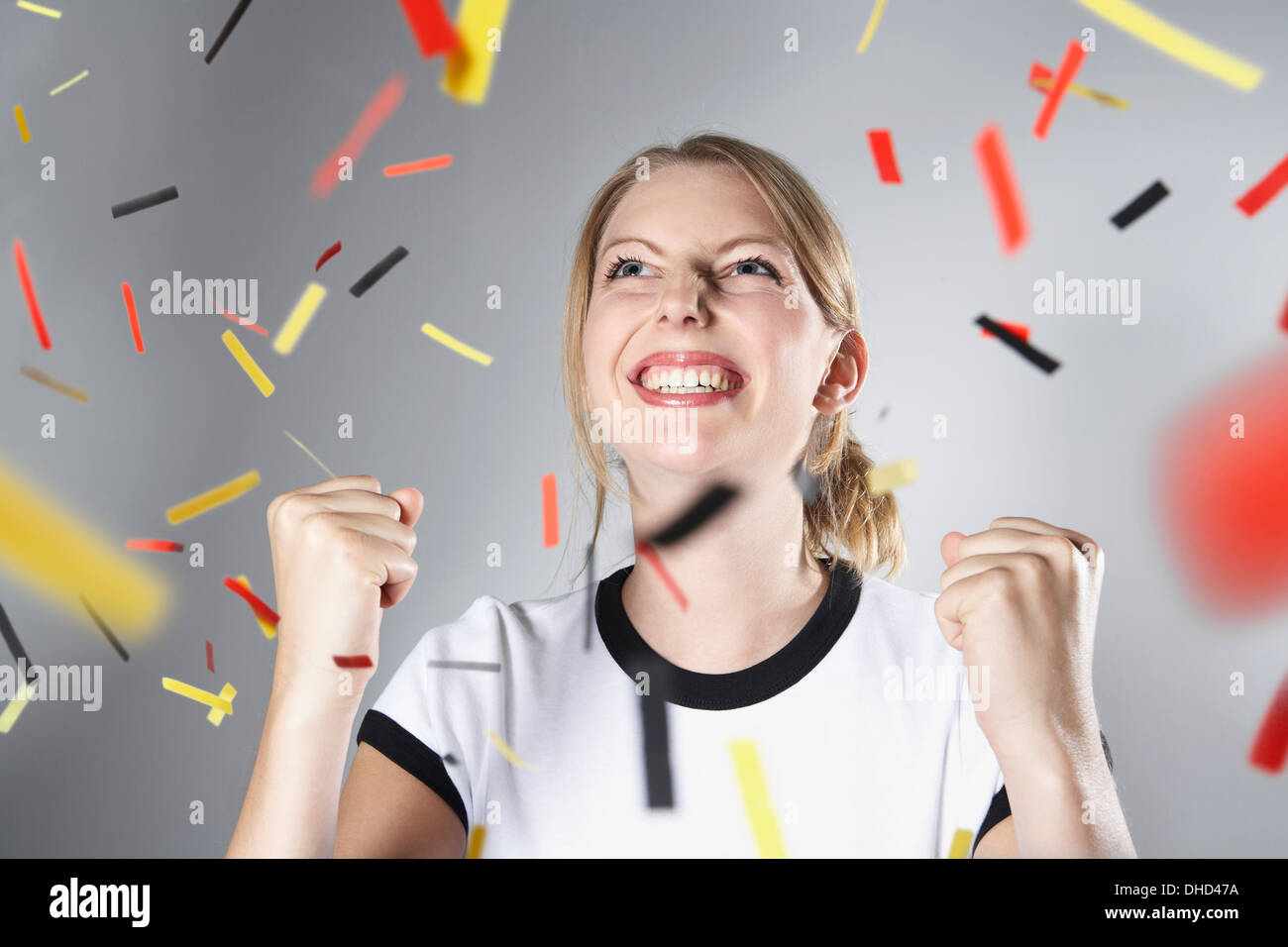 Woman in soccer jersey cheering Stock Photo - Alamy