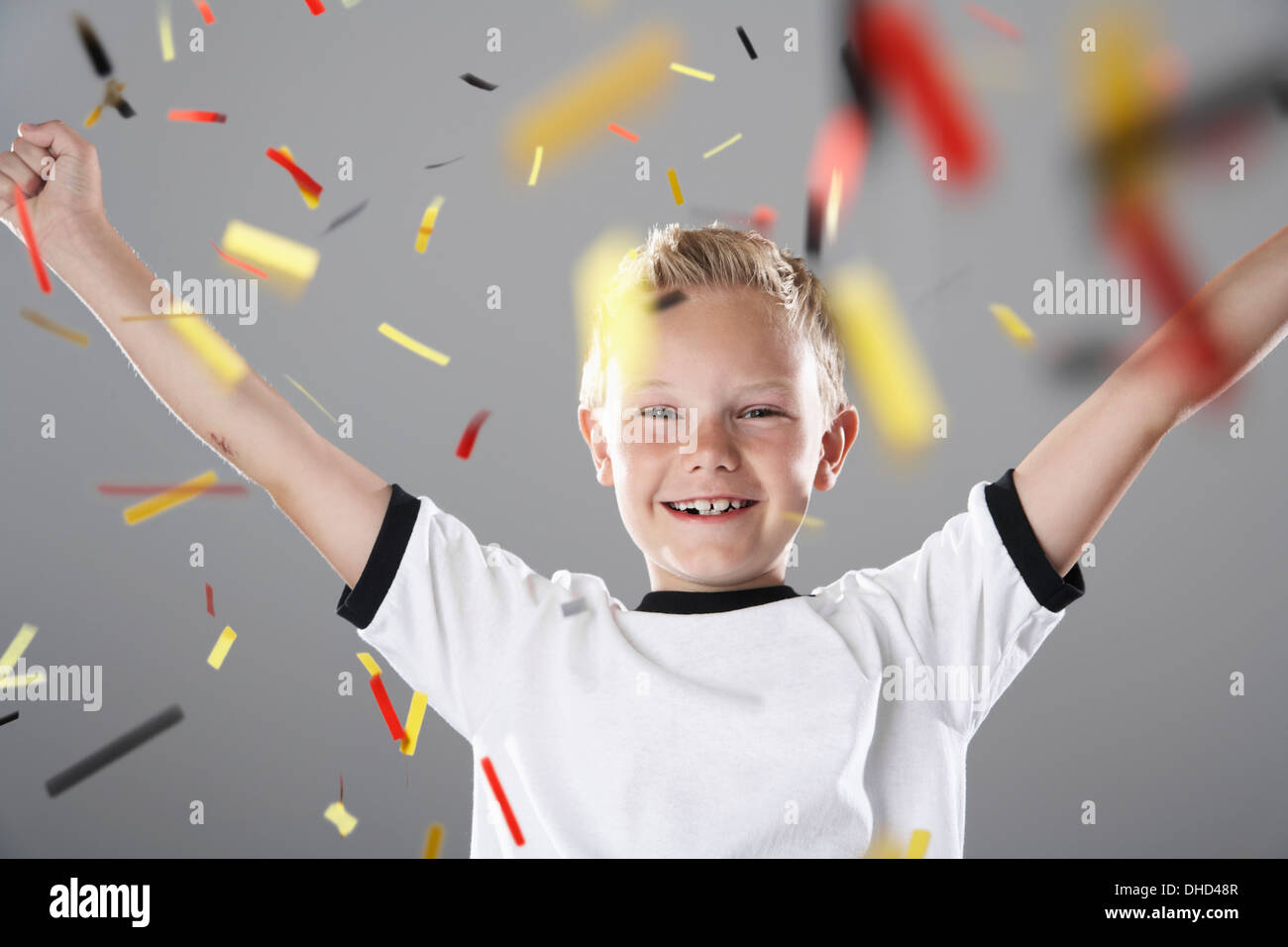 Boy in soccer jersey cheering Stock Photo - Alamy