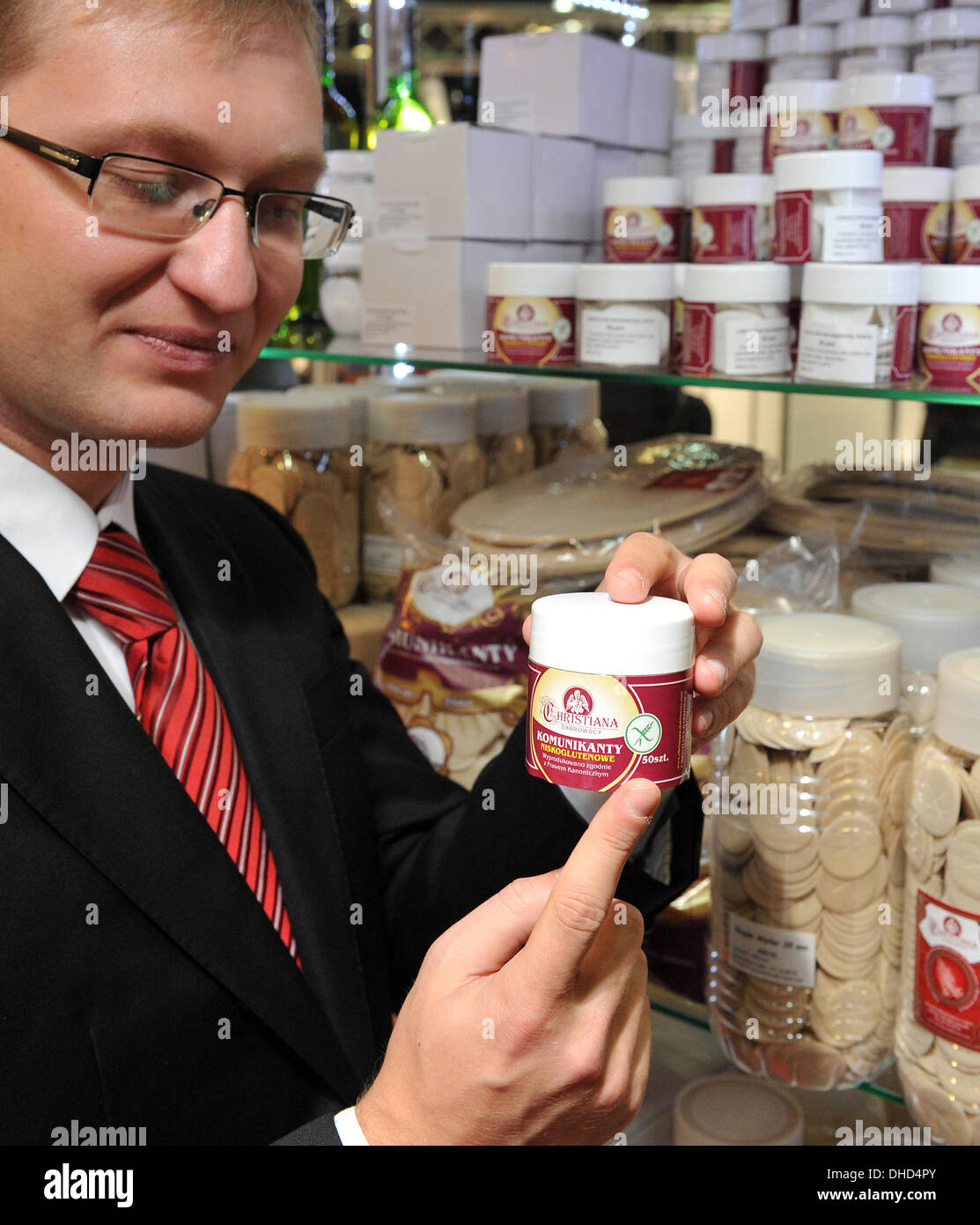 Daniel Dabrowski holds gluten-free communion wafers at a booth at the ...