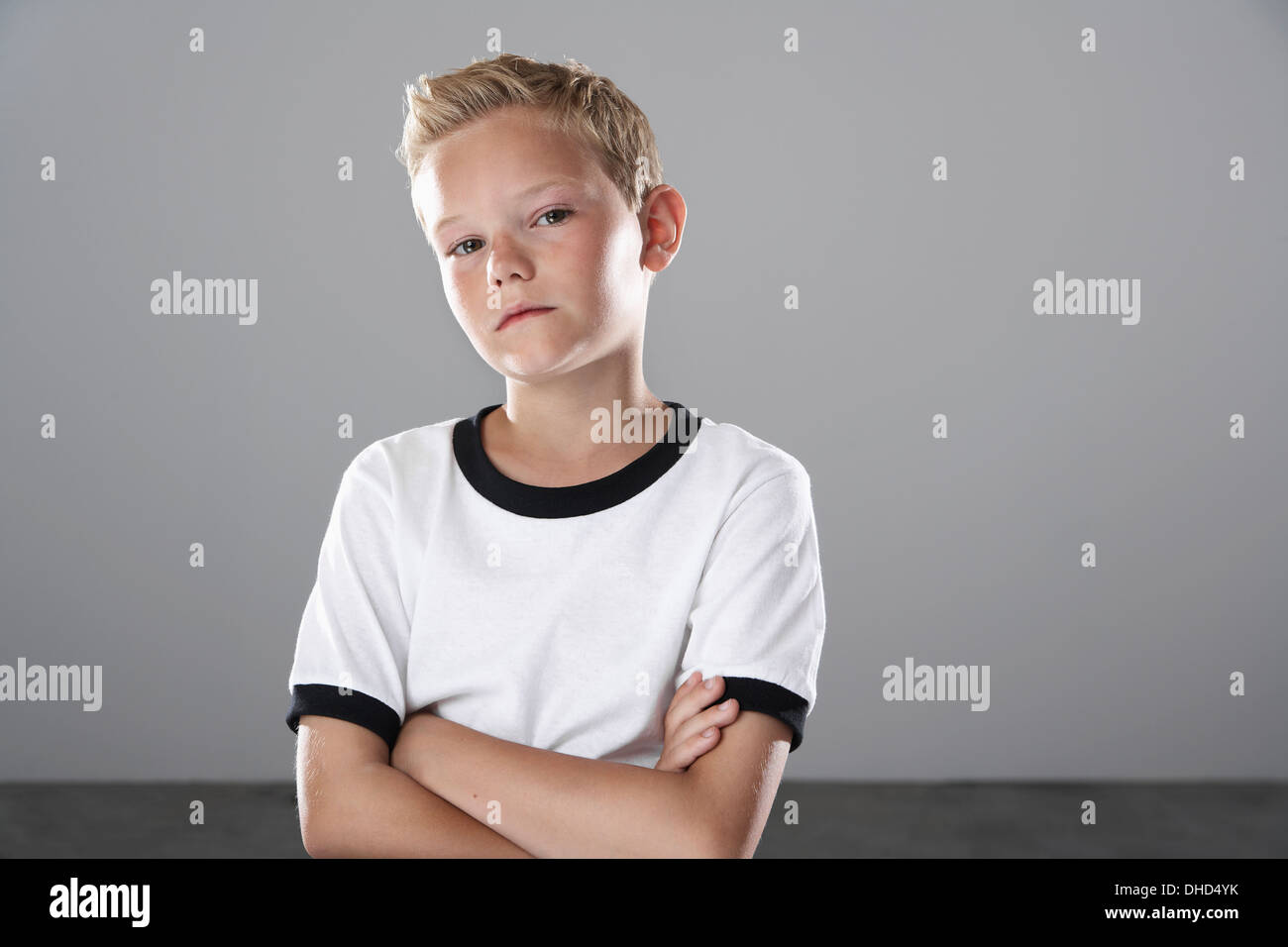 Confident boy in soccer jersey Stock Photo - Alamy